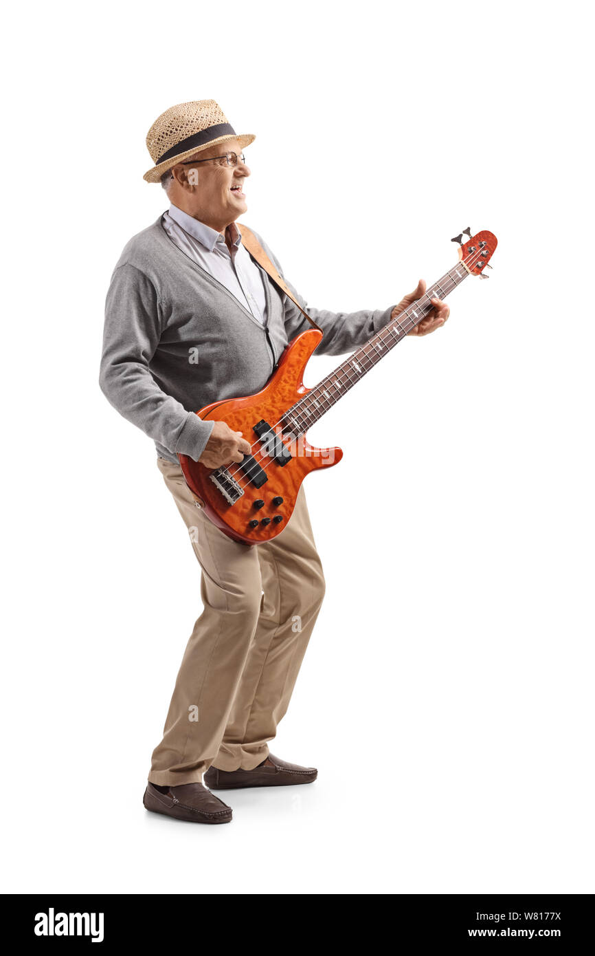 Full length shot of an elderly male guitarist playing a bass guitar ... Full length shot of an elderly male guitarist playing a bass guitar ...