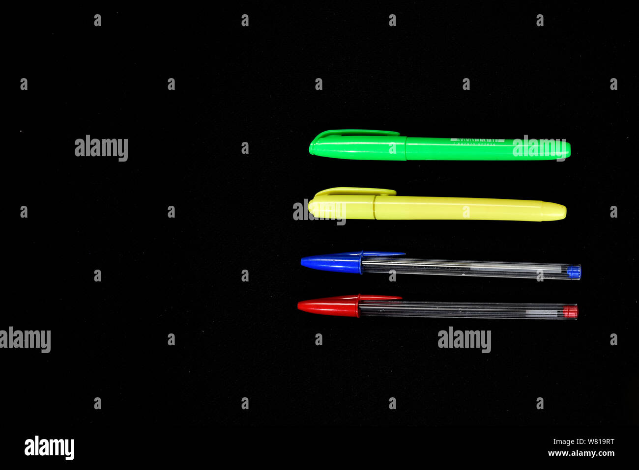 colorful ballpoint pens on black background Stock Photo - Alamy
