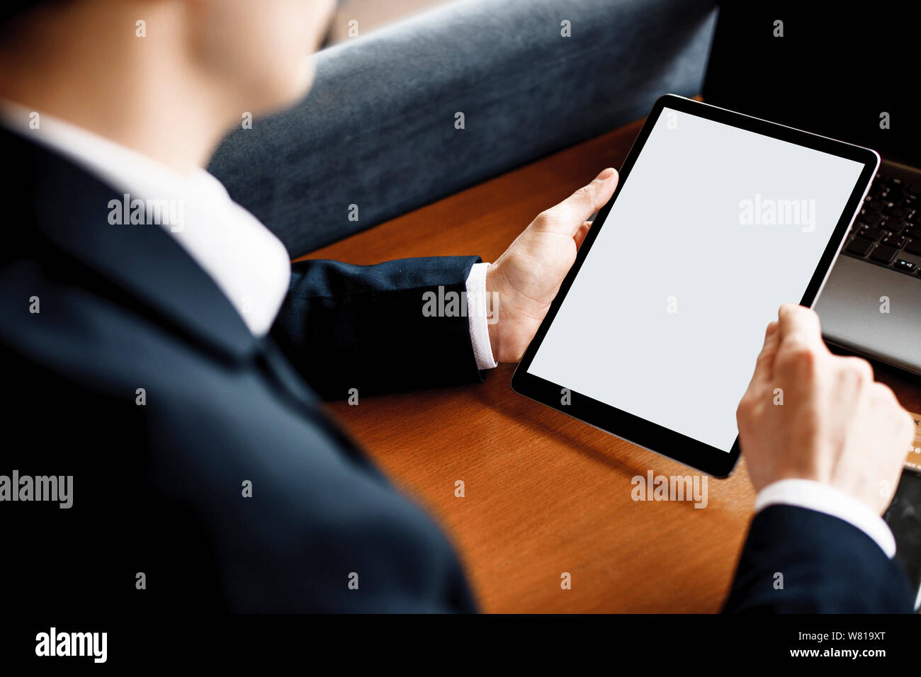 Businessman hands tablet house hi-res stock photography and images - Alamy