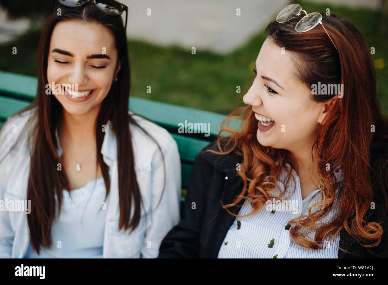 Close up portrait of a plus size women laughing while sitting on a ...