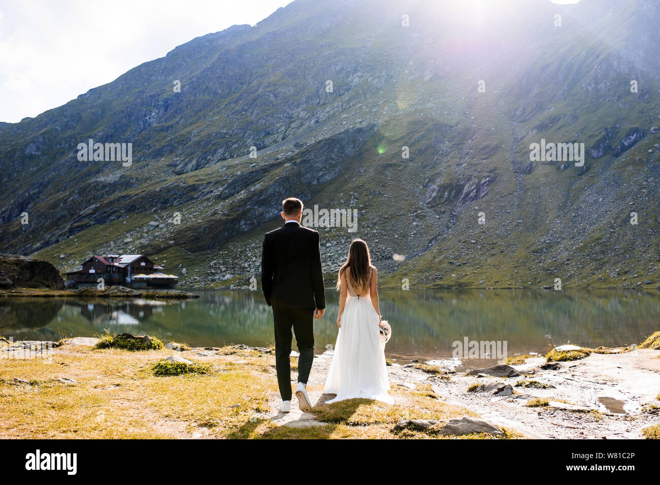 Bride and groom back view sitting hi-res stock photography and images ...