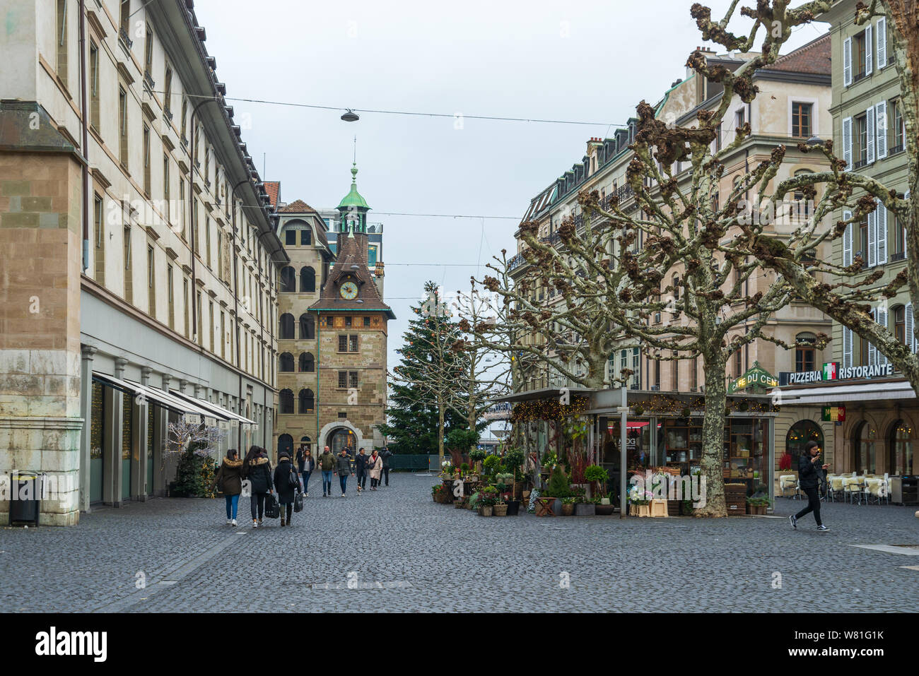 Street view of plaza downtown shopping district along with brand name ...