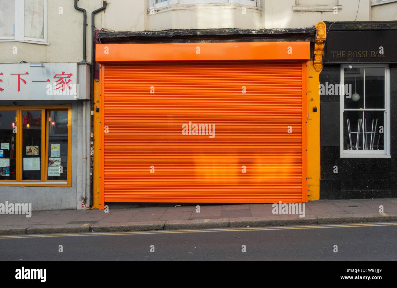 Secure bright orange door hi-res stock photography and images - Alamy