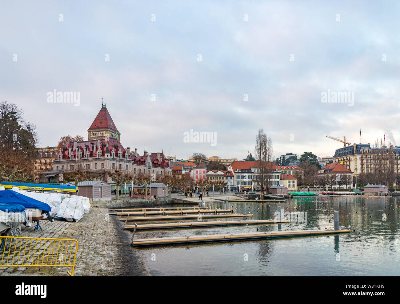 Outdoor scenery of promenade waterside of lake Geneva and hotel Château ...