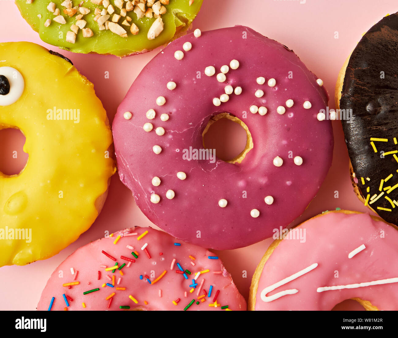 round different donuts with sprinkles, full frame Stock Photo - Alamy