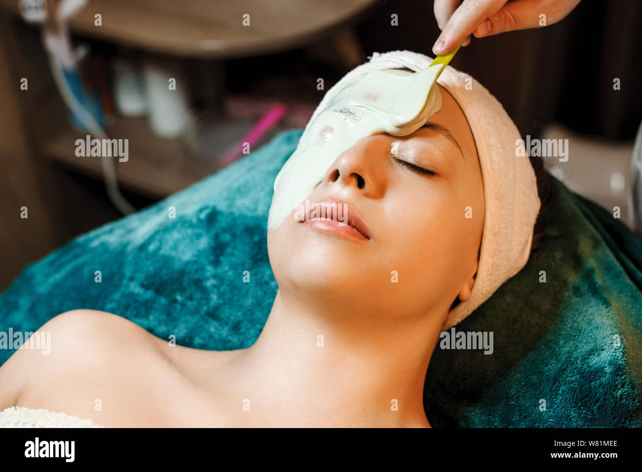 White alginate mask applied woman hi-res stock photography and images ...