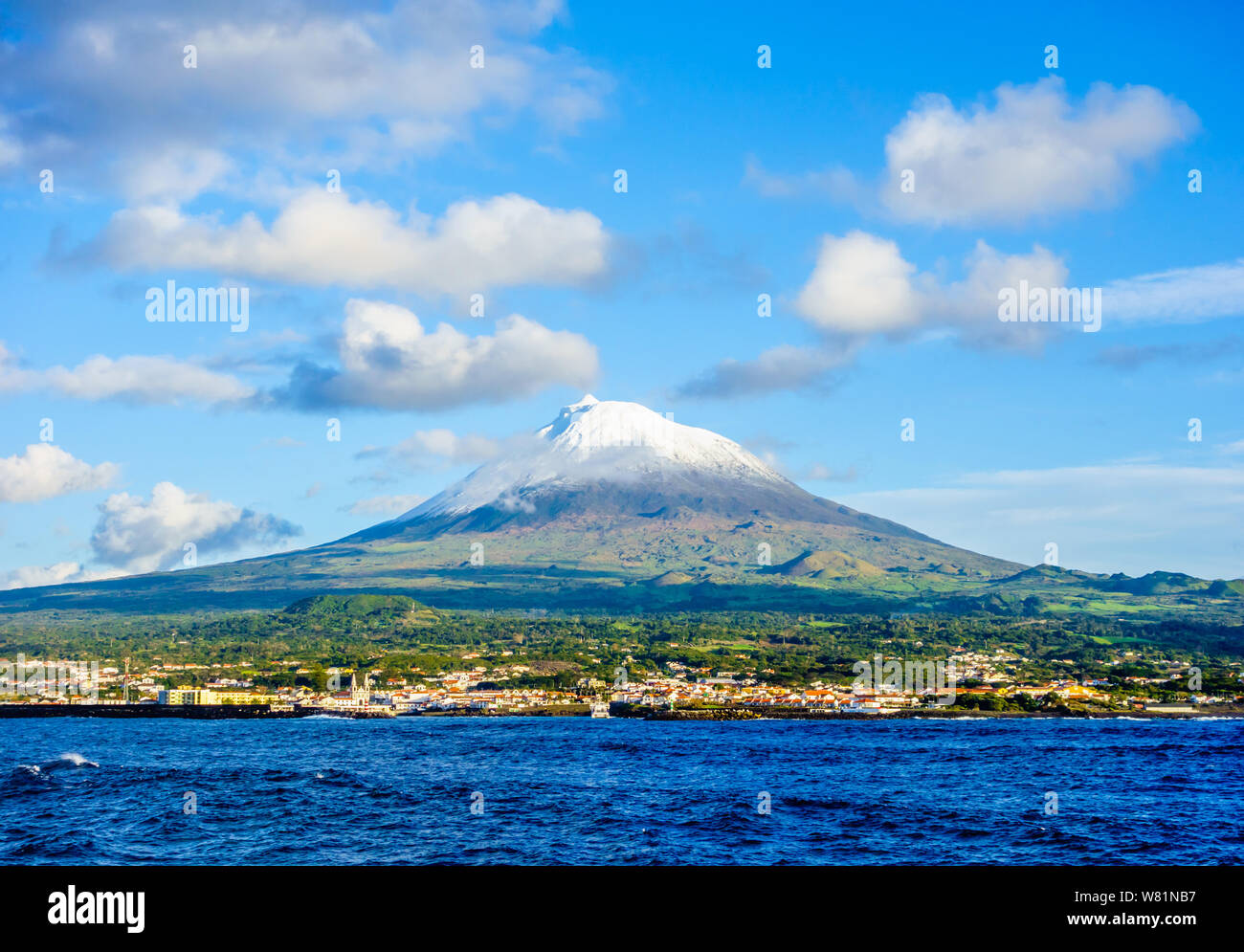 Mount Pico volcano western slope and town of Madalena viewed from ocean ...