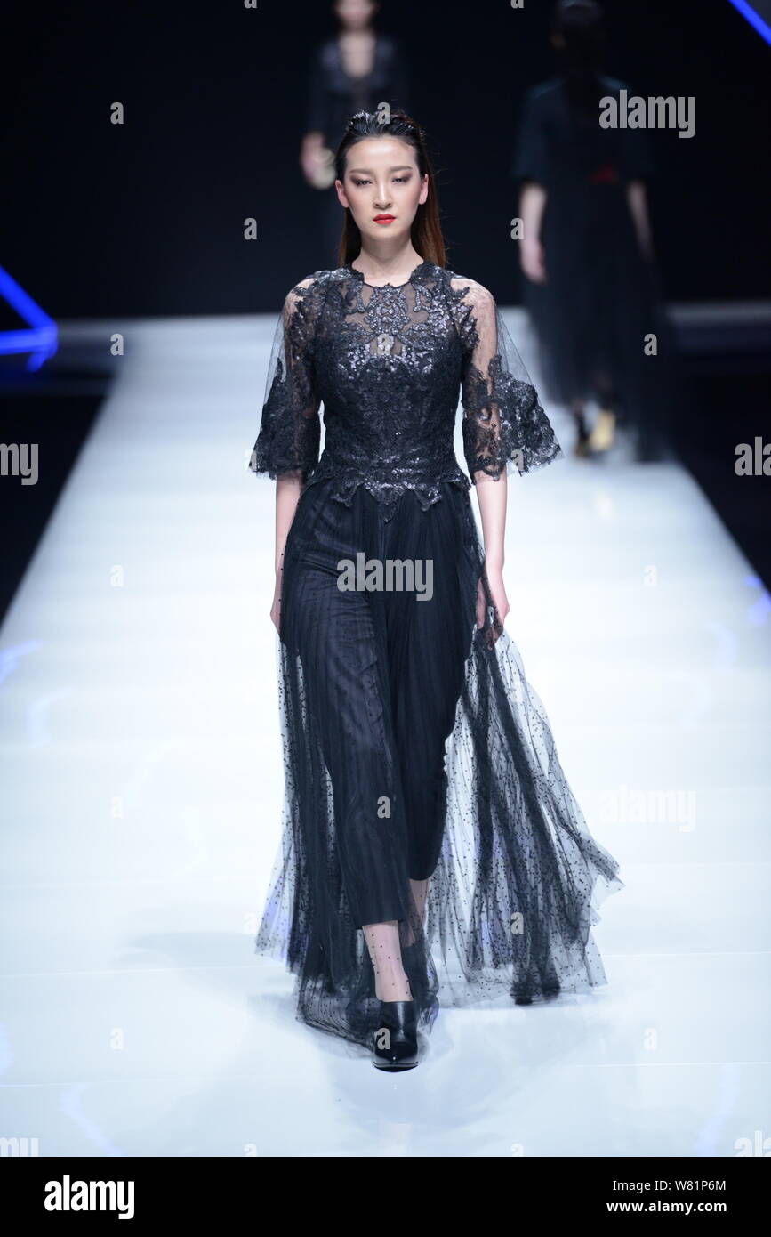 A model displays a new creation at the Asahi Kasei Chinese Fashion ...