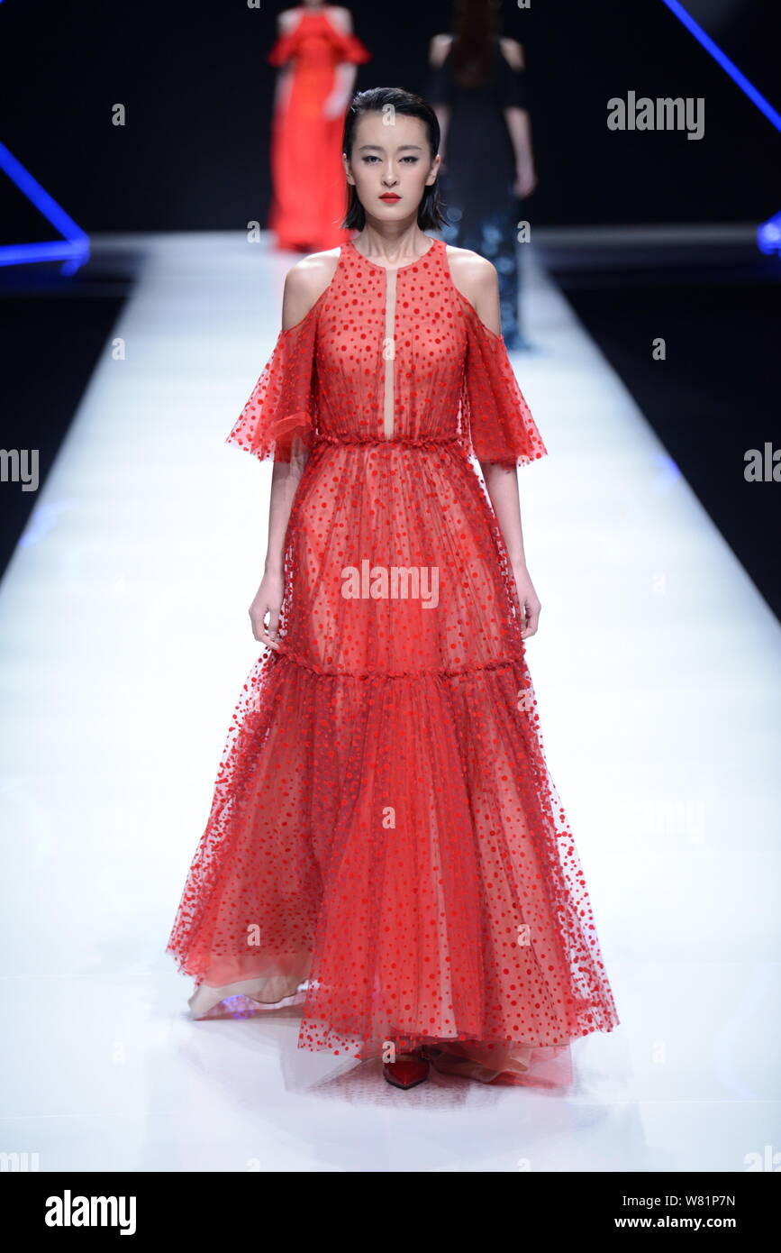 A model displays a new creation at the Asahi Kasei Chinese Fashion ...
