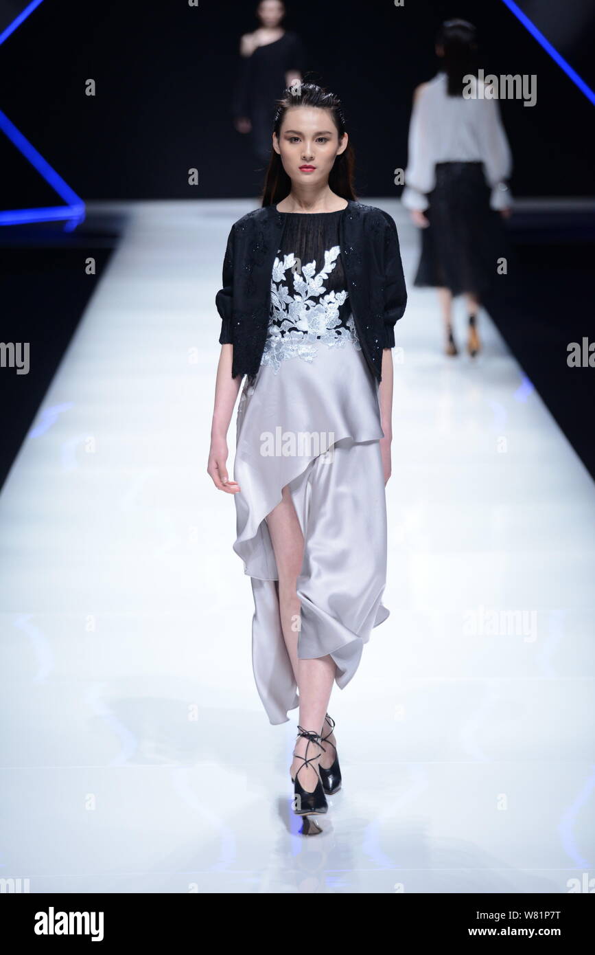 A model displays a new creation at the Asahi Kasei Chinese Fashion ...