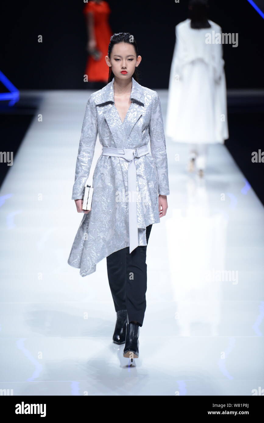 A model displays a new creation at the Asahi Kasei Chinese Fashion ...