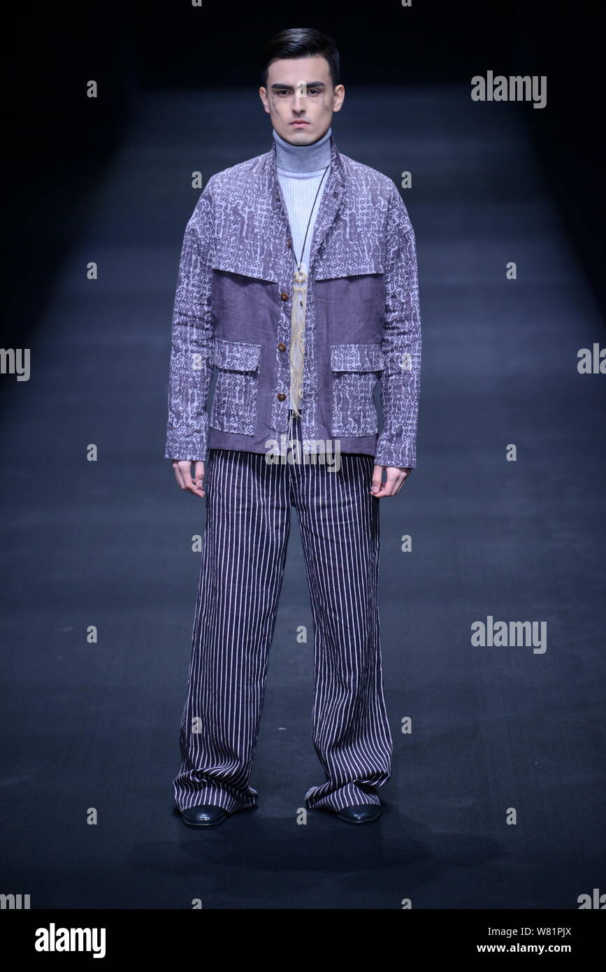 A model displays a new creation at the fashion show of XINSHEN LINEN by ...