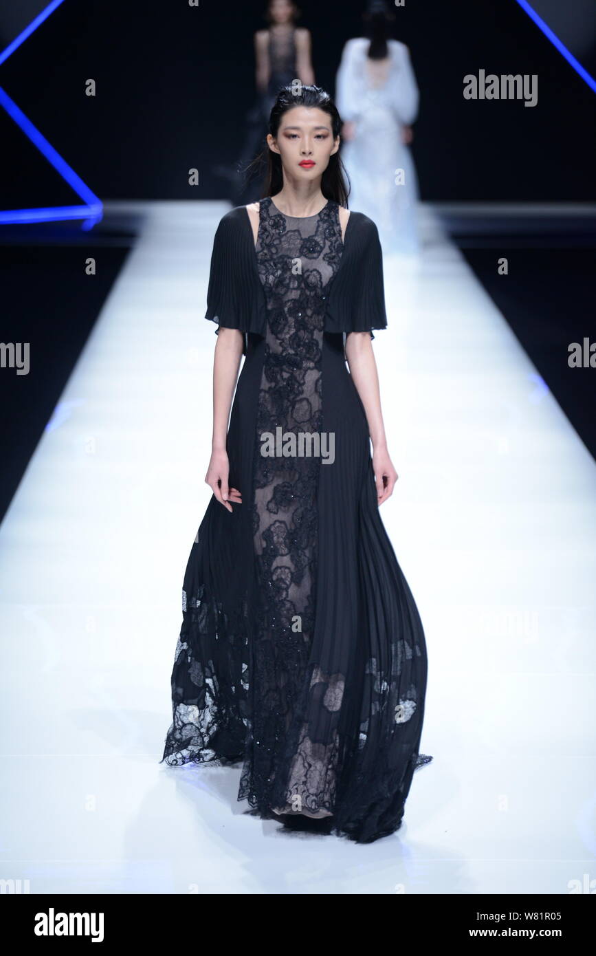 A model displays a new creation at the Asahi Kasei Chinese Fashion ...