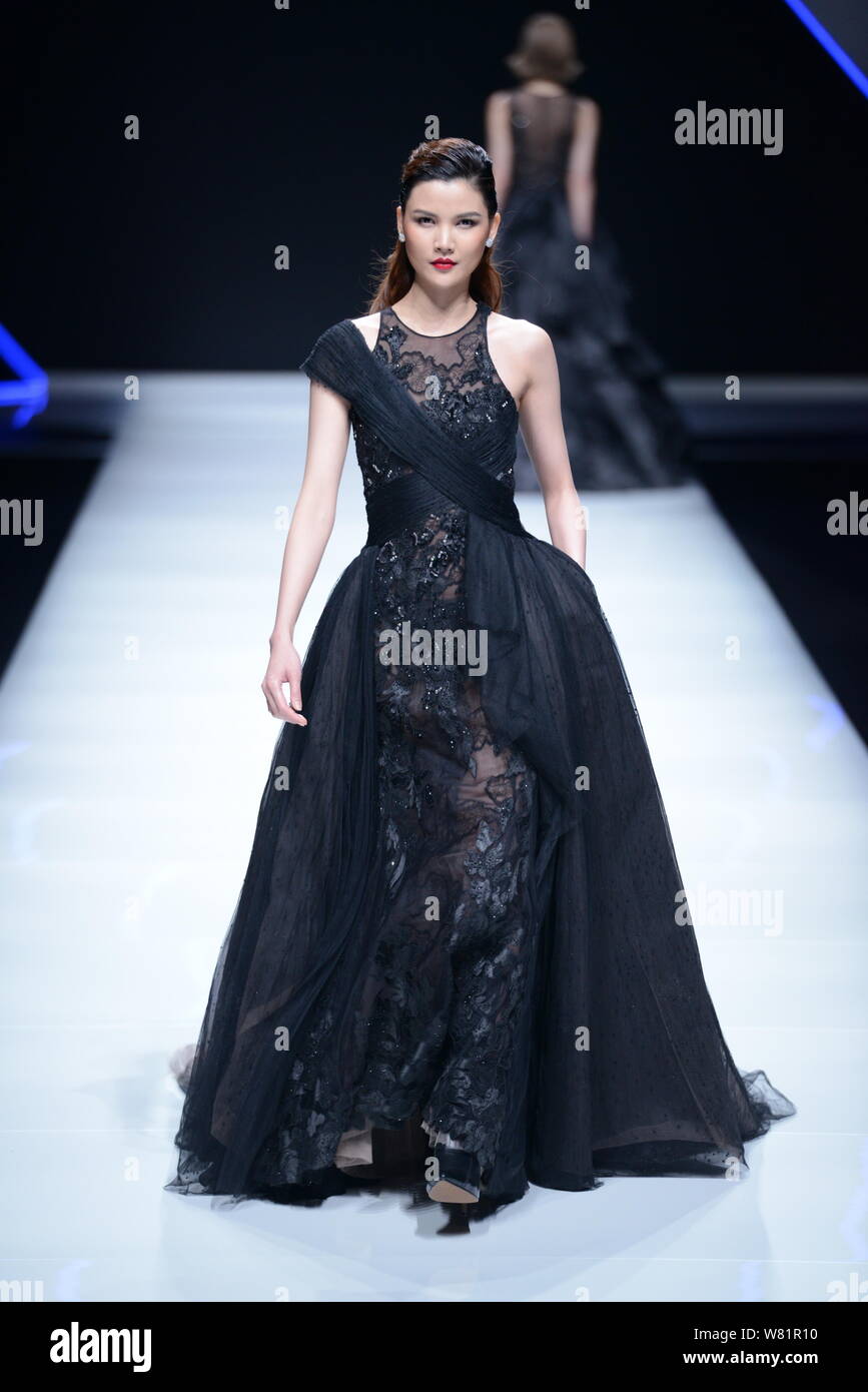 A model displays a new creation at the Asahi Kasei Chinese Fashion ...