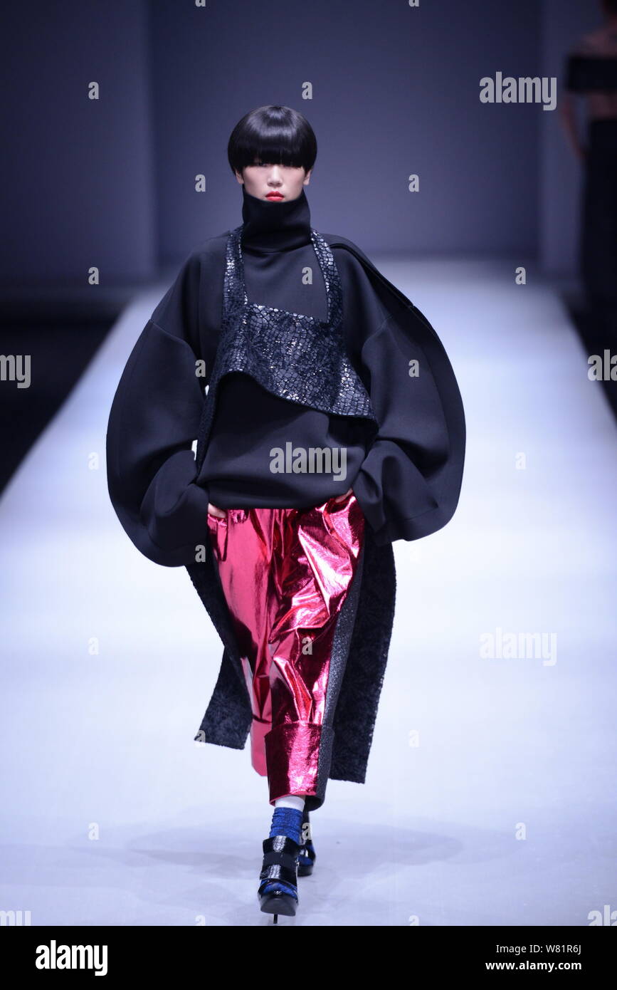 A model displays a new creation at the fashion show of ZIJUE by Chinese ...