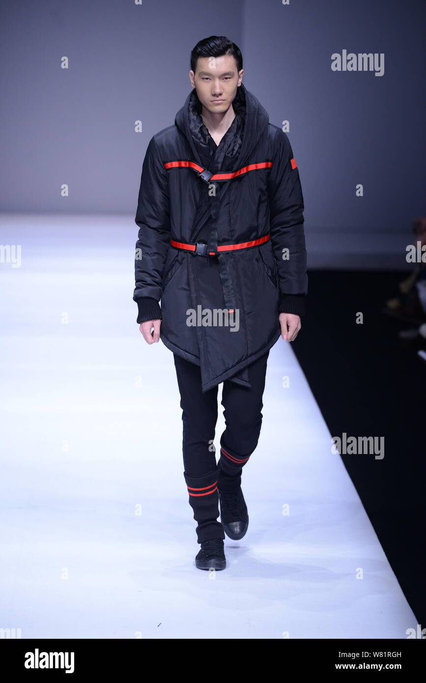 A model displays a new creation at the fashion show of HUANRAN WU by ...