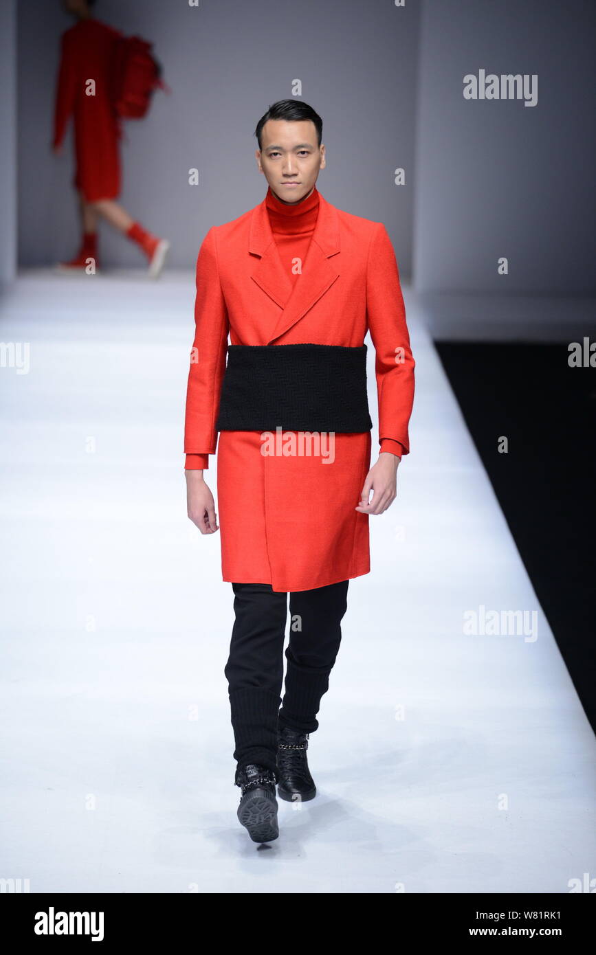 A model displays a new creation at the fashion show of HUANRAN WU by ...