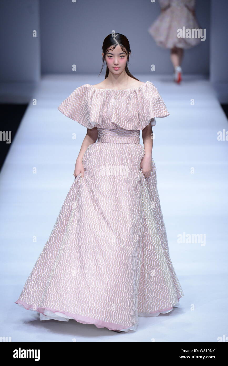 A model displays a new creation at the fashion show of Mija Design by ...