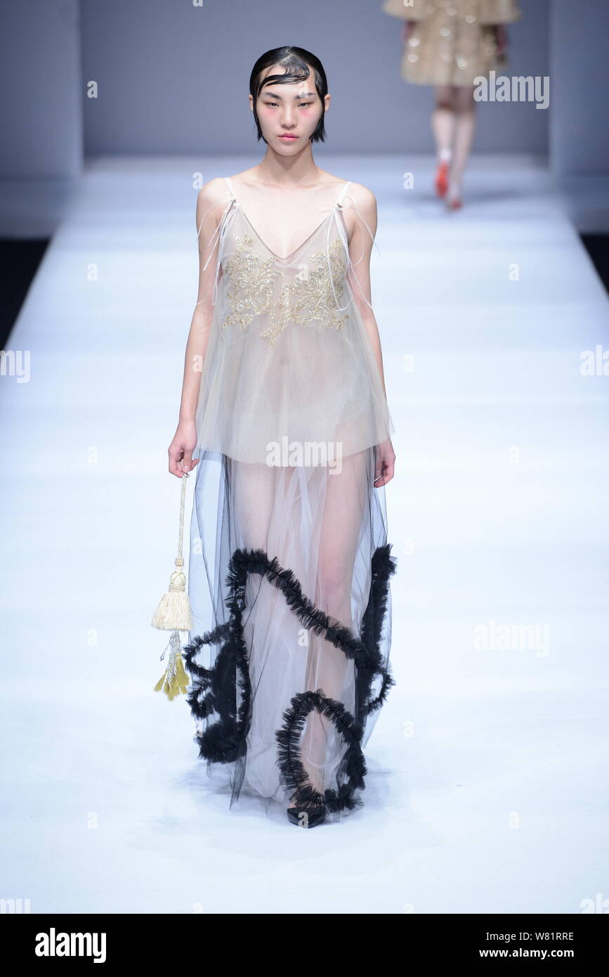 A model displays a new creation at the fashion show of Mija Design by ...