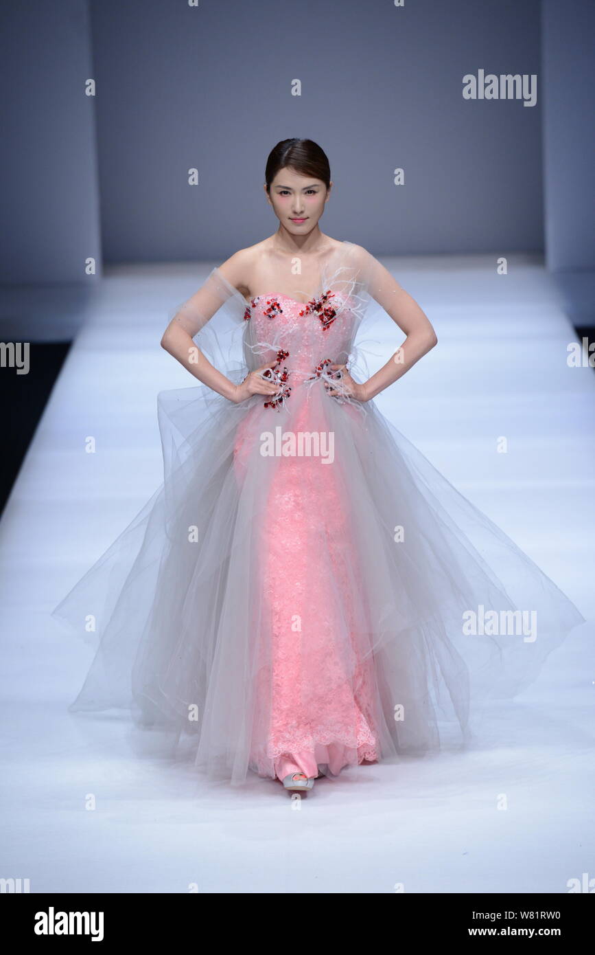 A model displays a new creation at the fashion show of Mija Design by ...