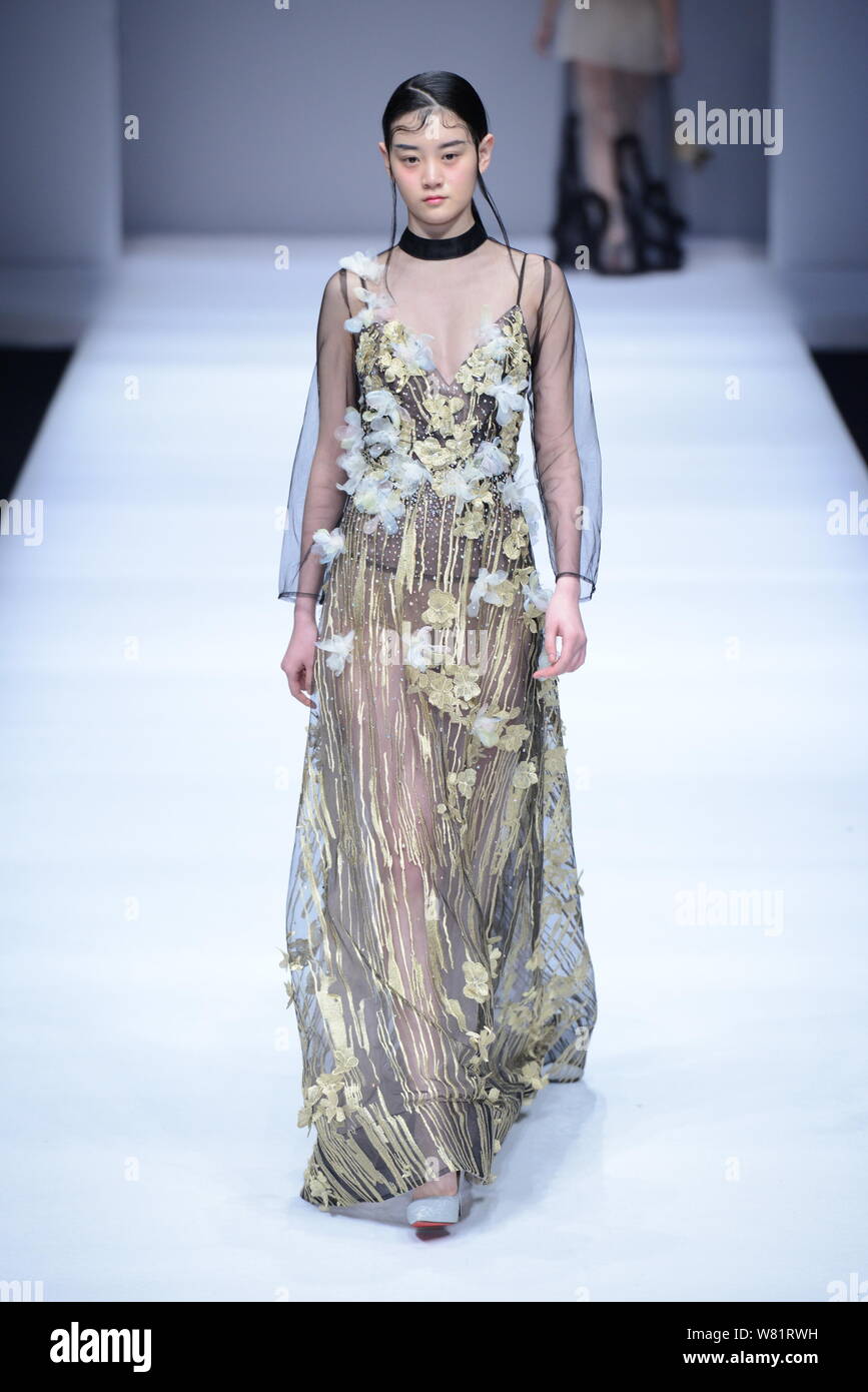 A model displays a new creation at the fashion show of Mija Design by ...