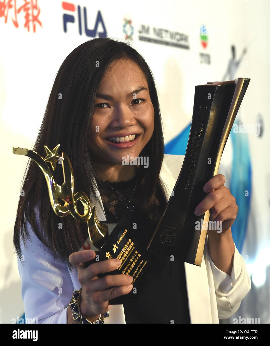 Hong Kong racing cyclist Sarah Lee Wai Sze poses with her trophies ...