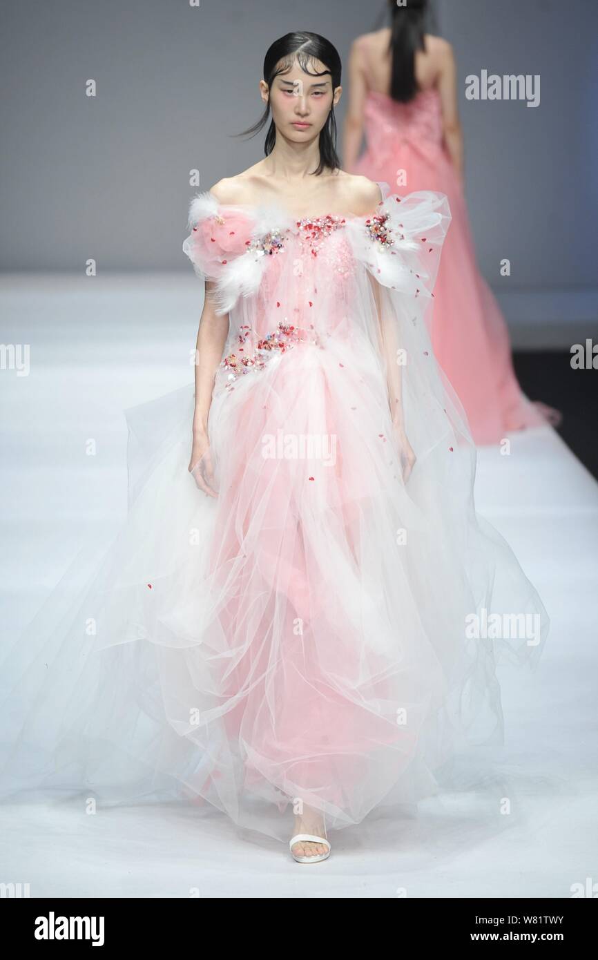 A model displays a new creation at the fashion show of Mija Design by ...