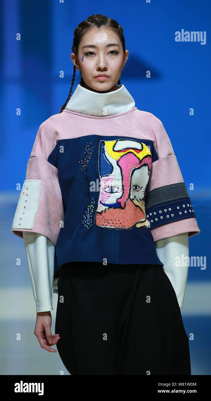 A model displays a creation by a graduate during a fashion show for ...