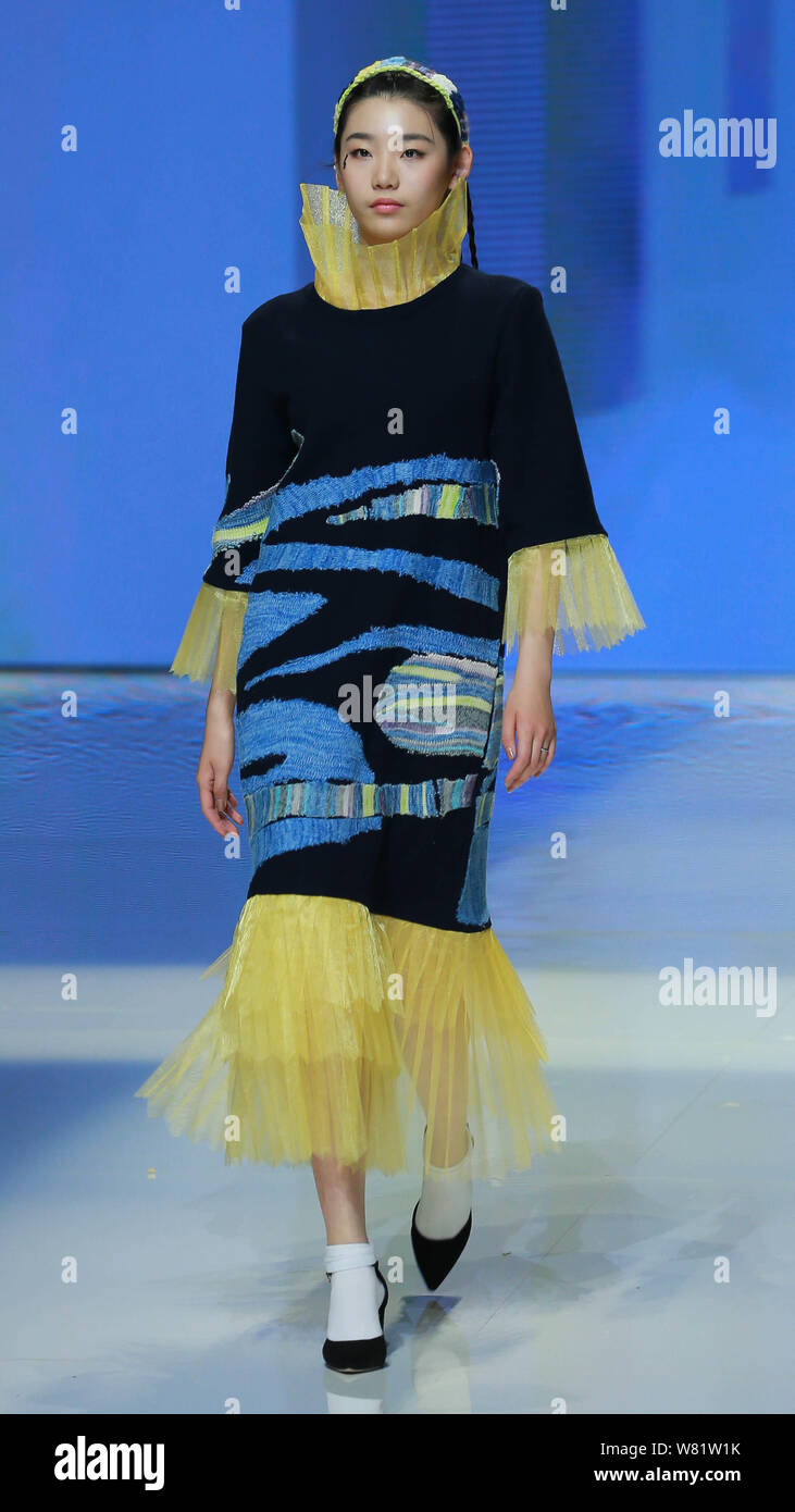 A model displays a creation by a graduate during a fashion show for ...