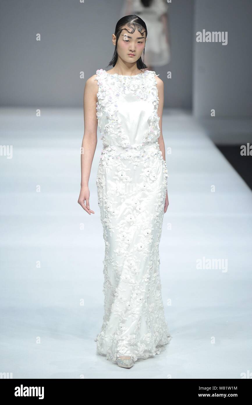 A model displays a new creation at the fashion show of Mija Design by ...