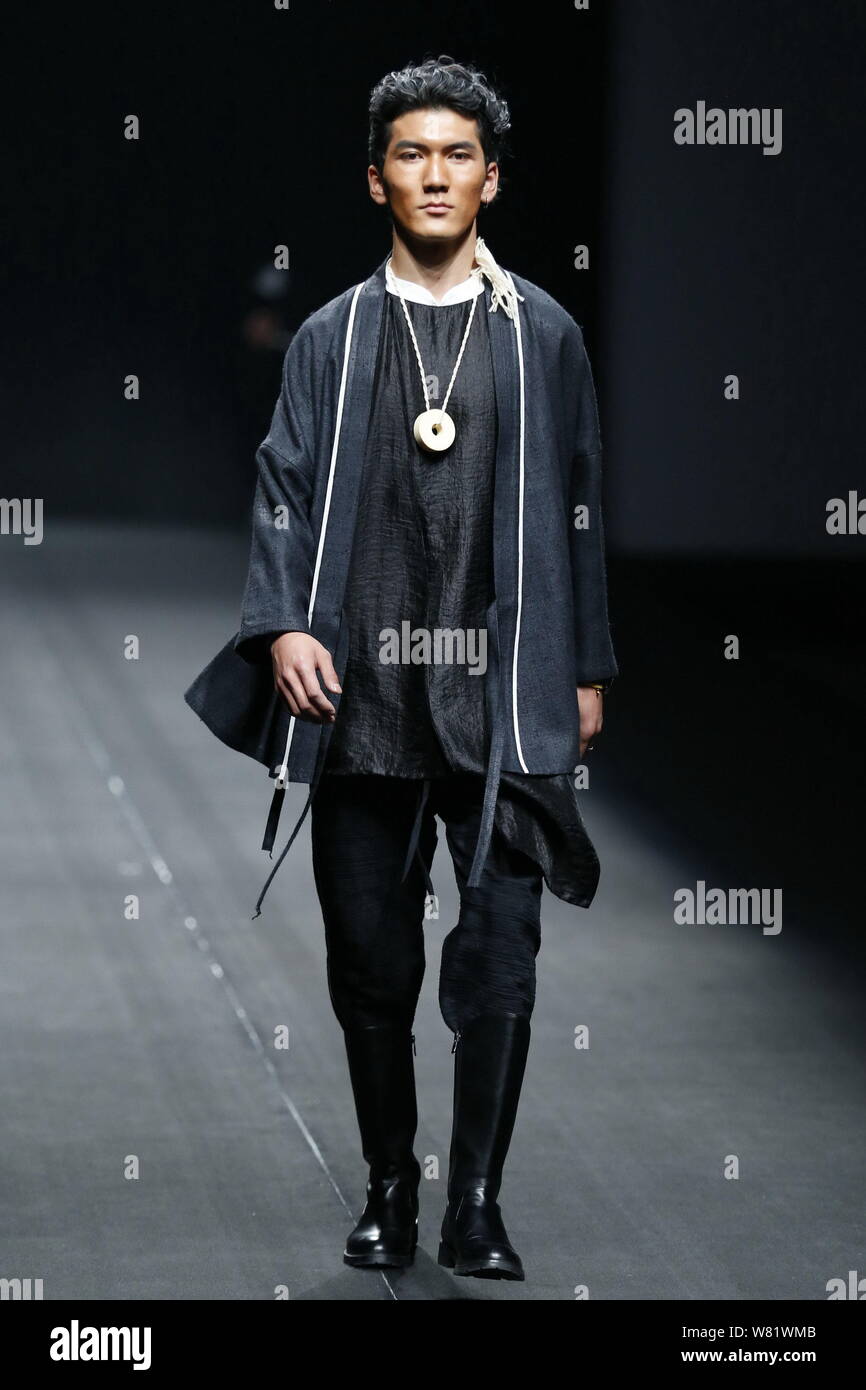 A model displays a new creation at the fashion show of AJ-NAMO during ...