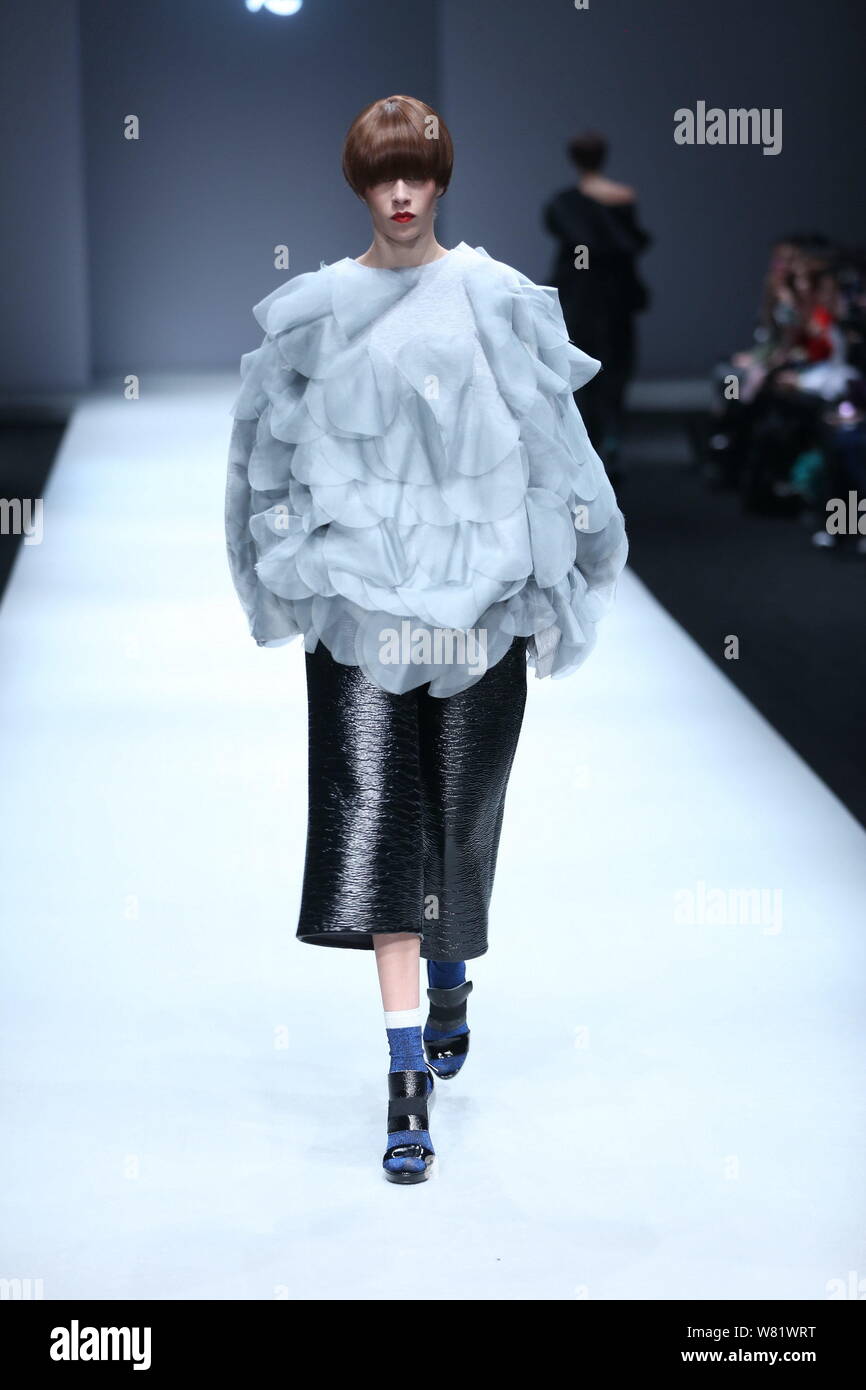 A model displays a new creation at the fashion show of ZIJUE by Chinese ...