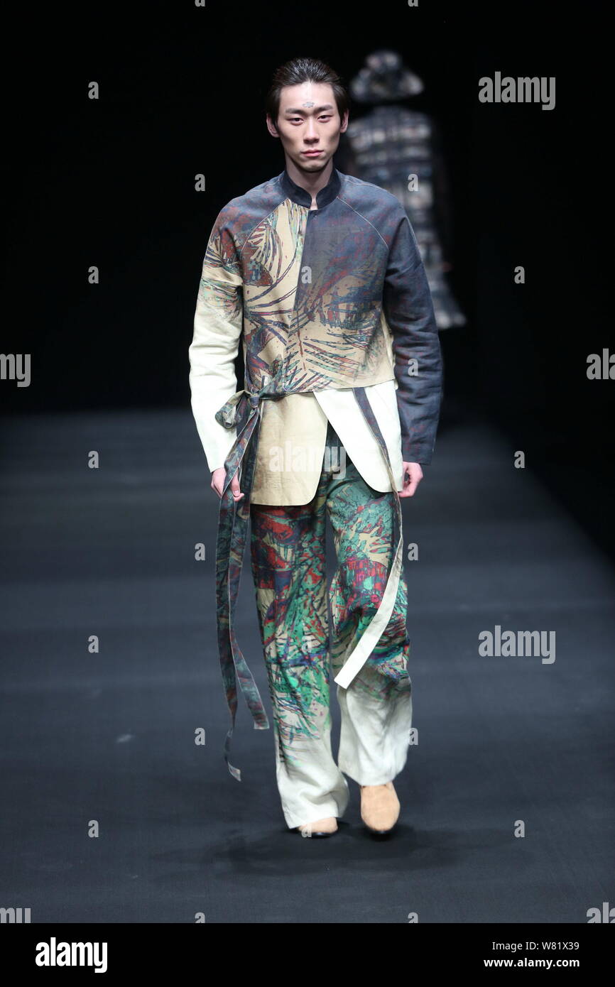 A model displays a new creation at the fashion show of XINSHEN LINEN by ...