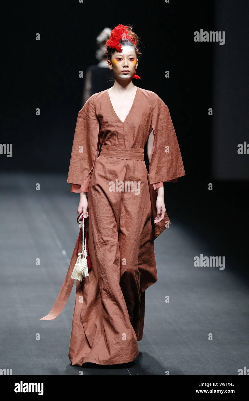 A model displays a new creation at the fashion show of AJ-NAMO during ...