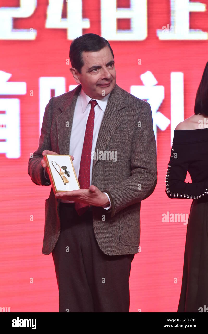 English actor Rowan Atkinson plays Mr. Bean during a premiere for his ...