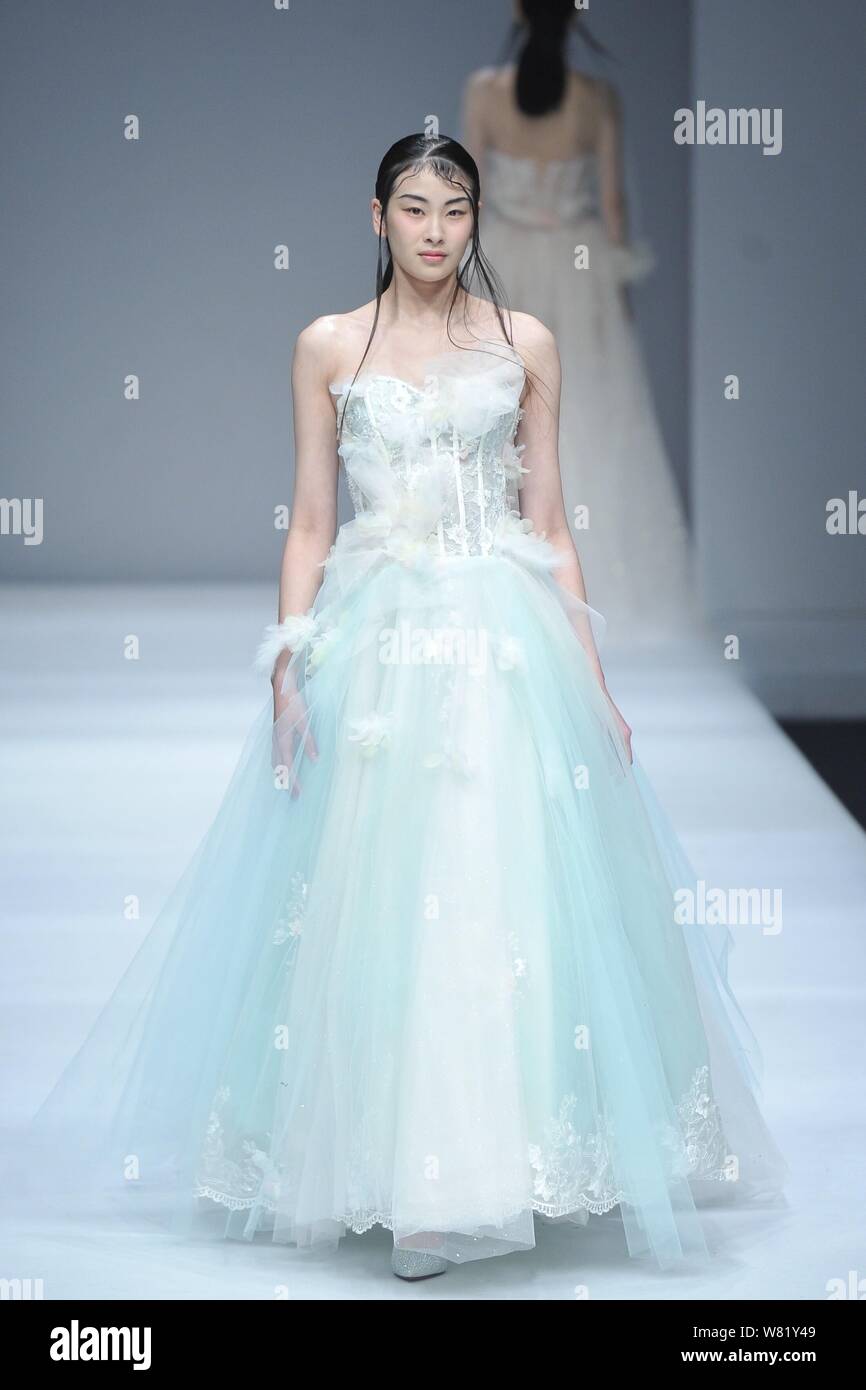 A model displays a new creation at the fashion show of Mija Design by ...