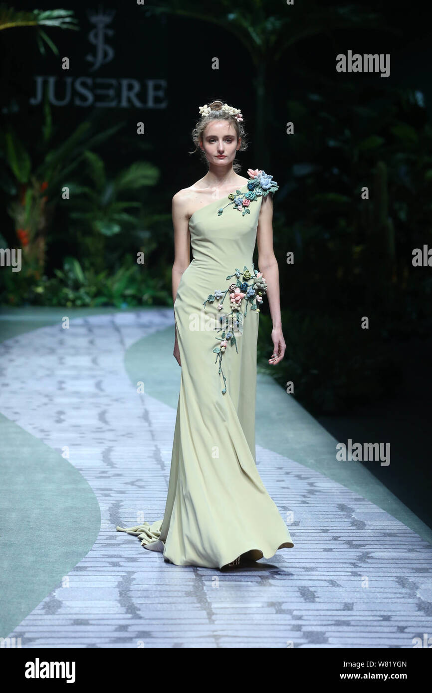 A model displays a new creation at the fashion show of JUSERE by ...