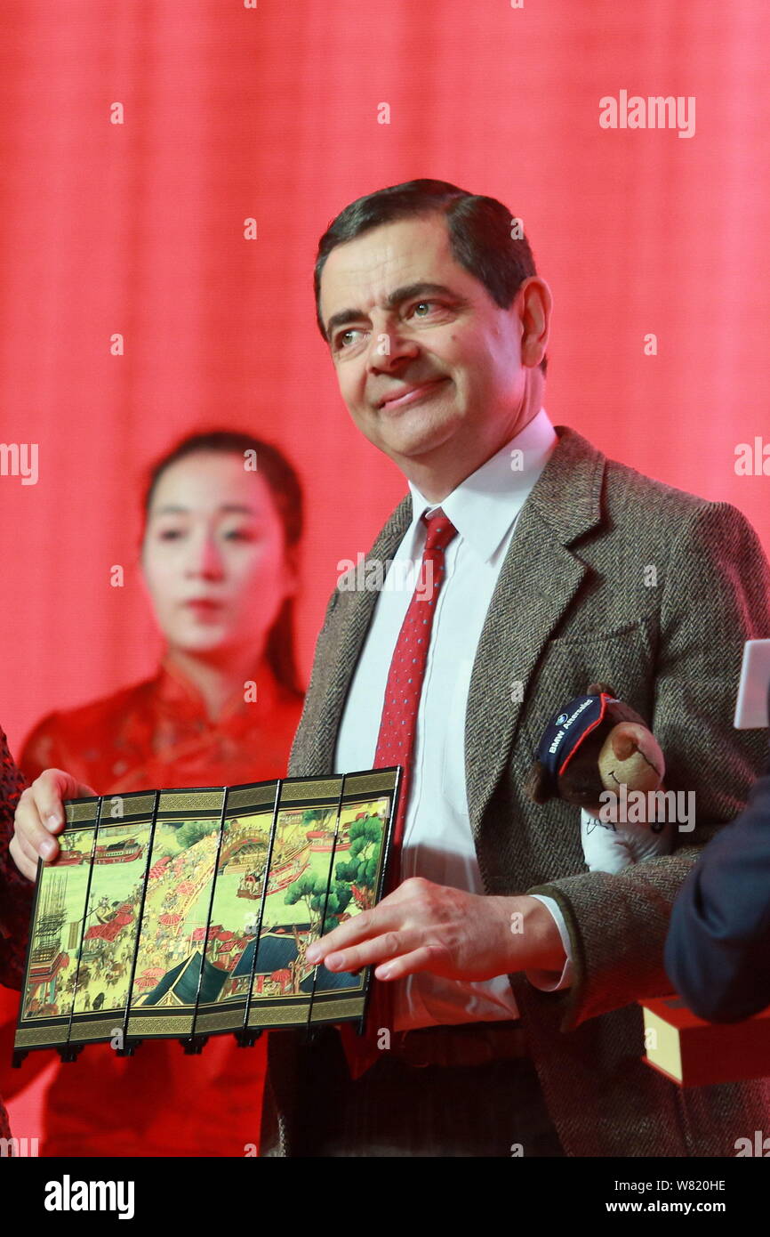 English actor Rowan Atkinson plays Mr. Bean during a premiere for his ...