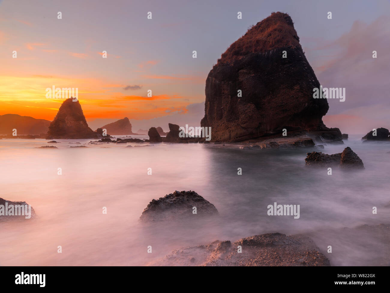 Papuma beach rocks floating in water mist at sunrise, most exotic beach ...