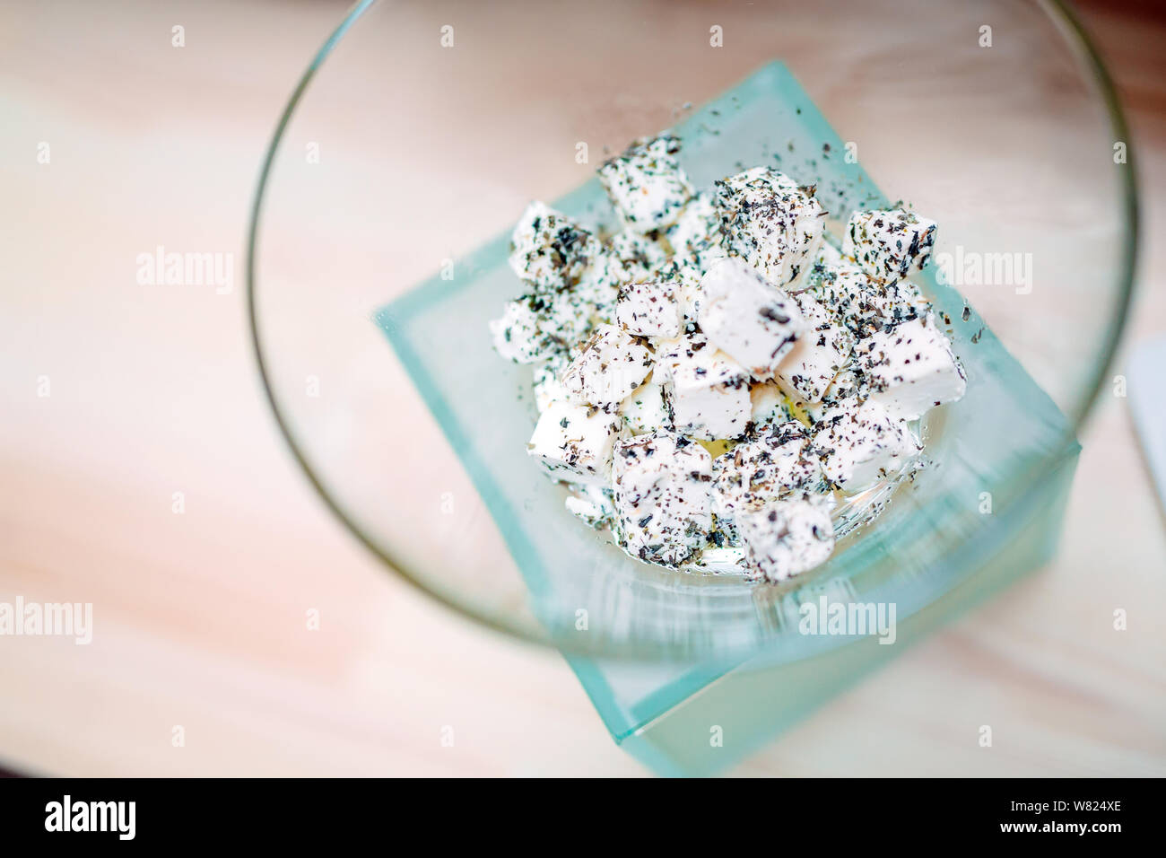 Feta cheese in a transparent bowl in a restaurant Stock Photo - Alamy