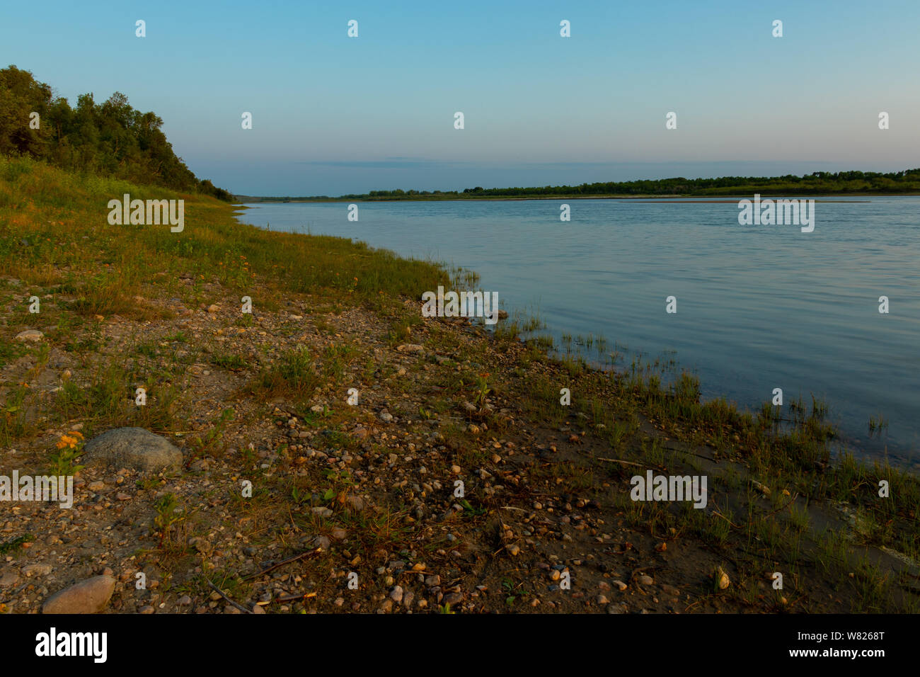 Summer evening along the South Saskatchewan River in rural Saskatchewan ...