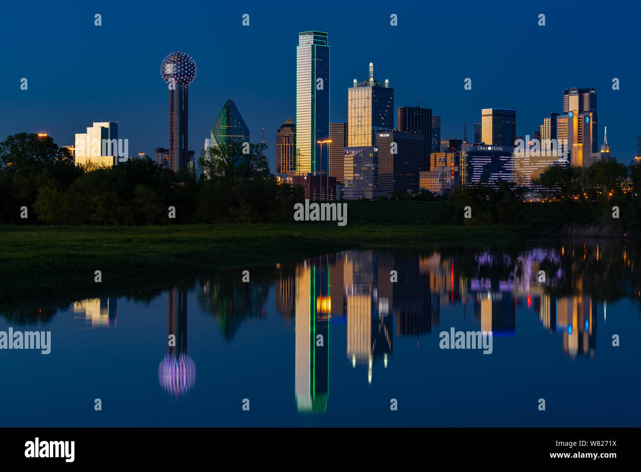 Beautiful night cityscape view of downtown Dallas, Texas reflecting off ...