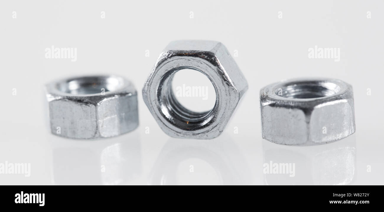 metal nuts tool on a white background Stock Photo - Alamy