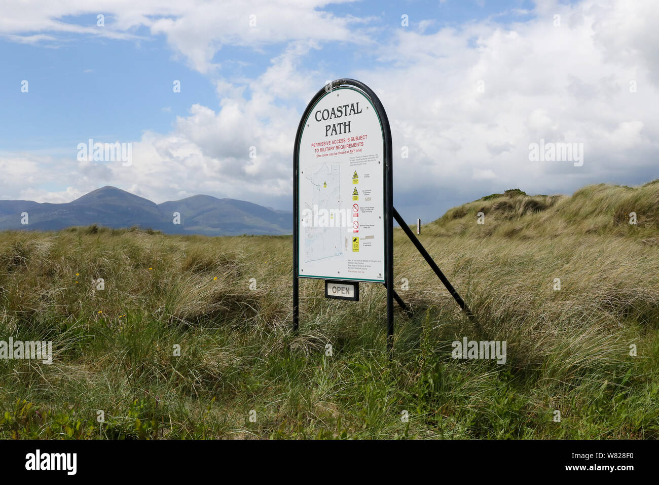 Permissive coastal path in UK with sign and rules in sand dunes at ...