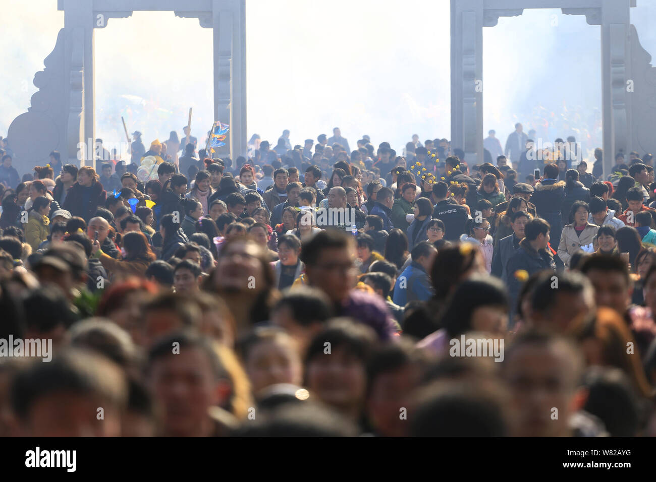 Chinese worshippers crowd the Taiping Bridge to pray for good luck on ...