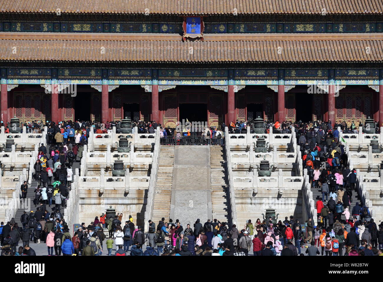 Tourists visit the Palace Museum, also known as the Forbidden City ...