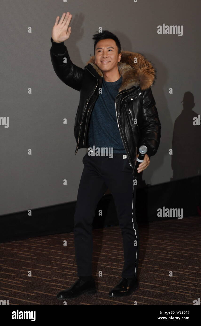 Hong Kong actor Donnie Yen waves as he arrives for a fan meeting to ...