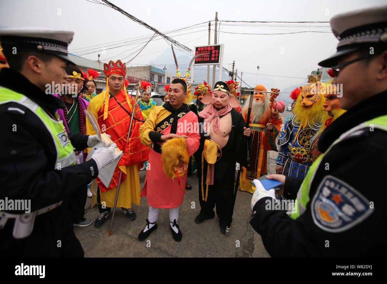 Police officers are surrounded by actors who were on their way to a ...