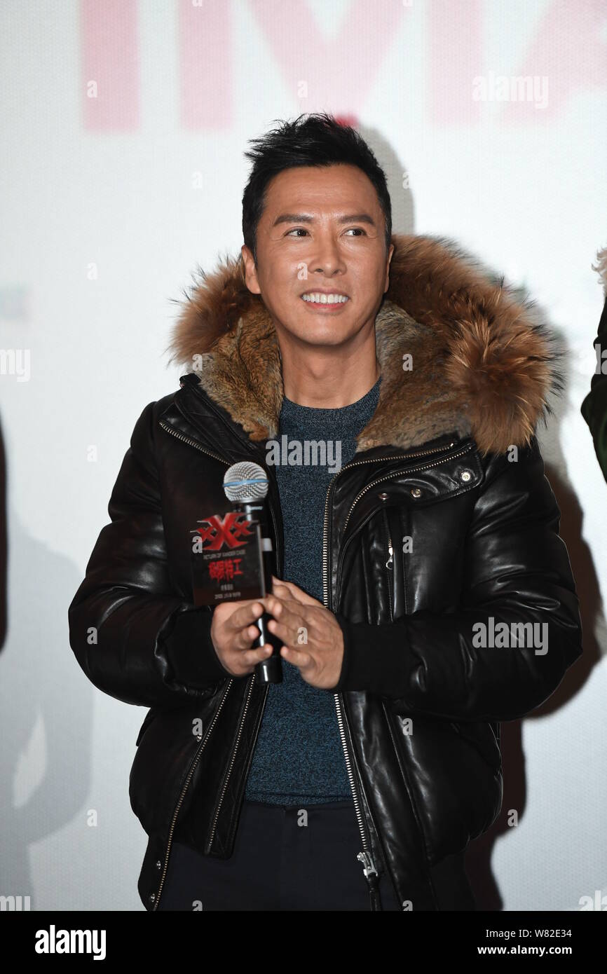 Hong Kong actor Donnie Yen reacts during a fan meeting to promote his ...