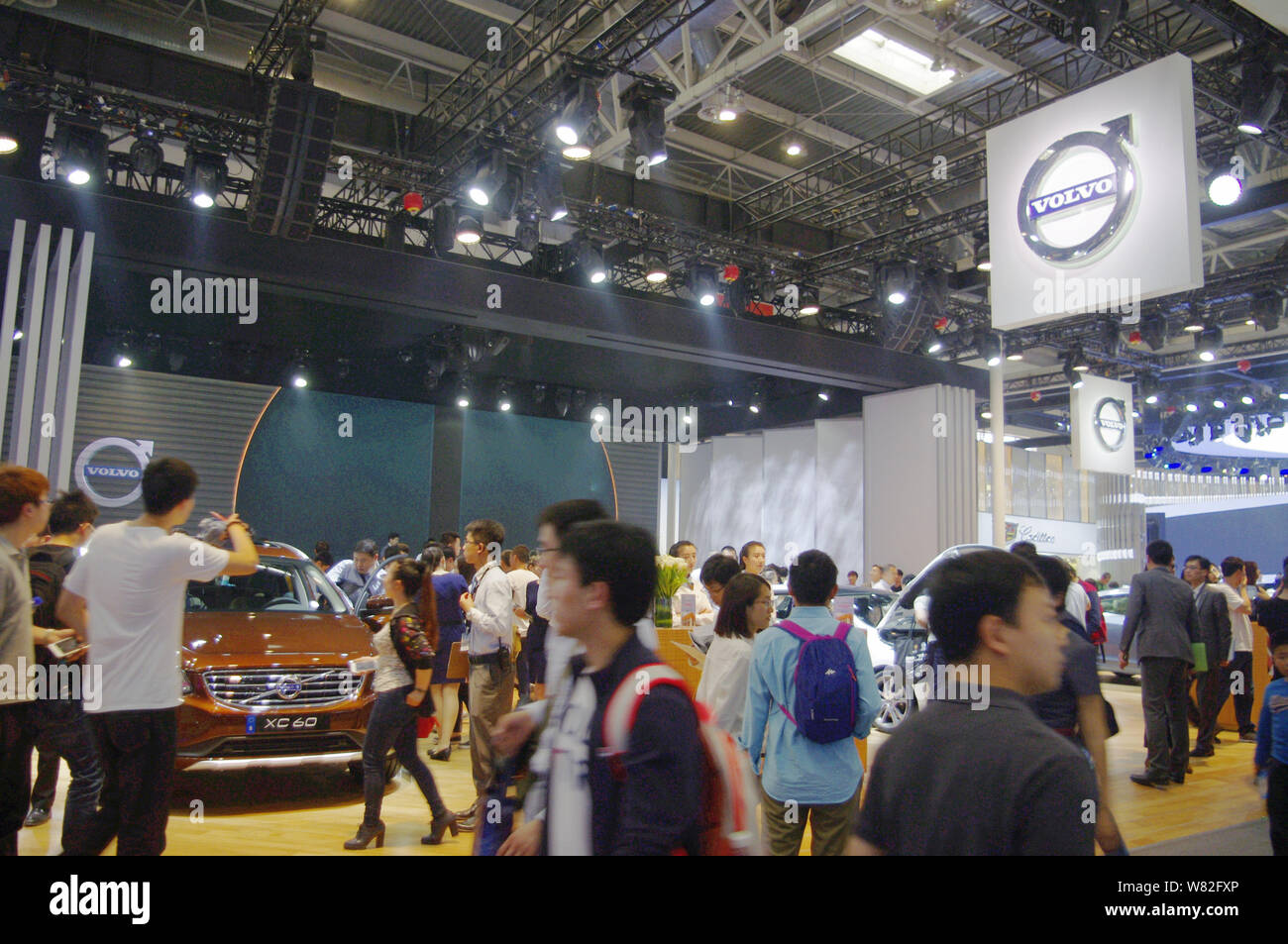--FILE--Visitors crowd the stand of Volvo during the 14th Beijing ...